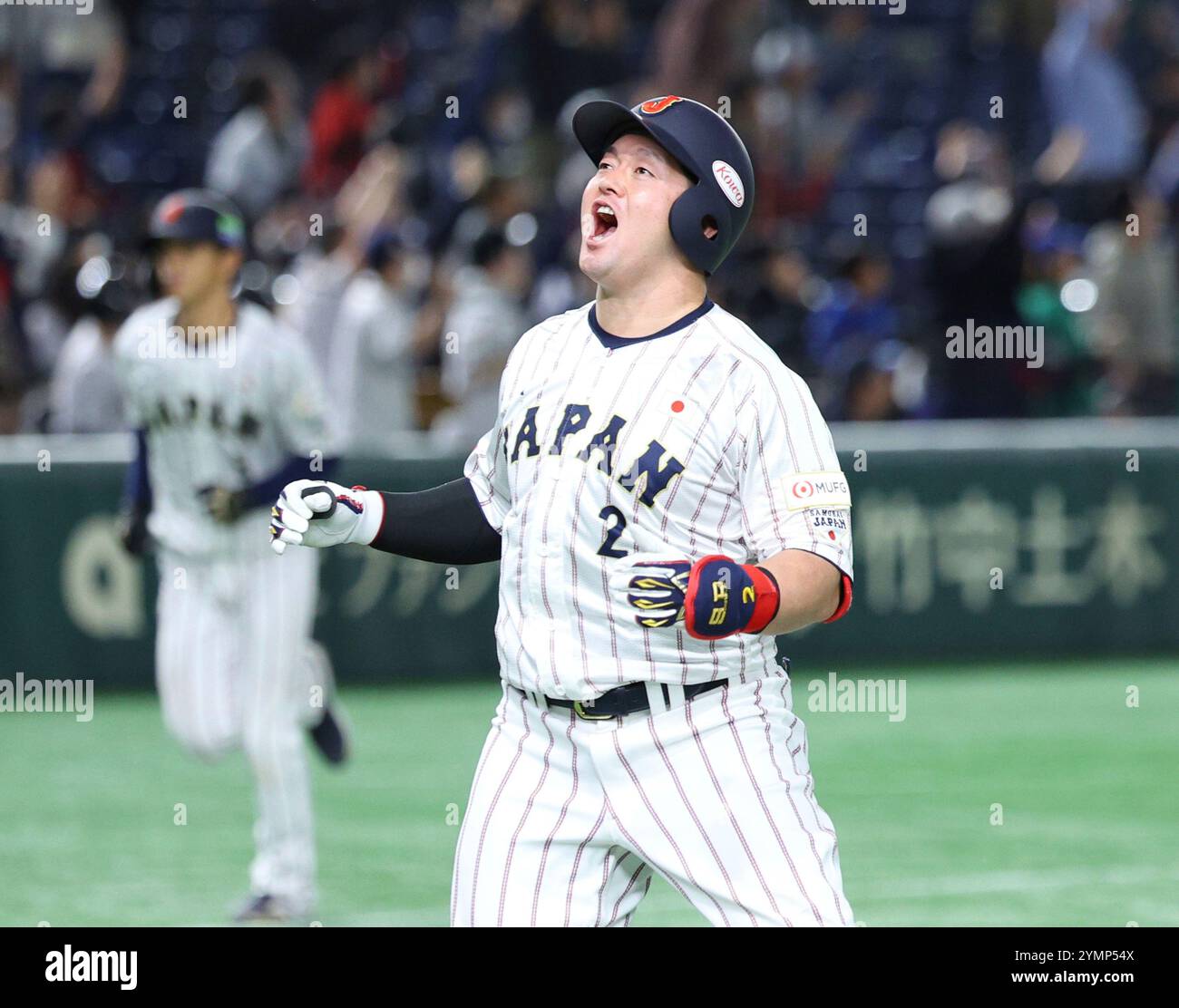 Japan's Shugo MAKI reacts after hitting a grand slam in the sixth ...