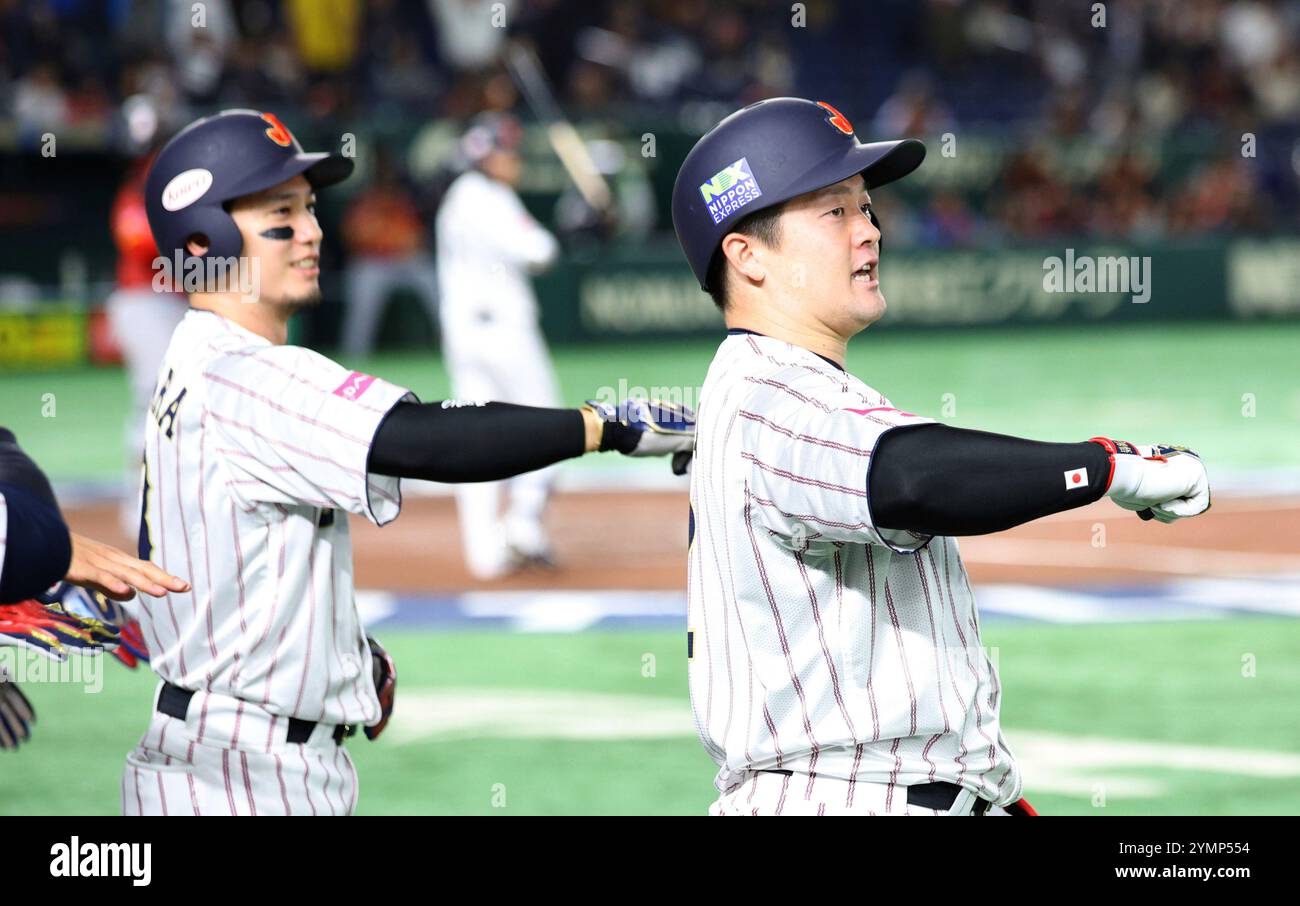 Japan's Shugo MAKI (R) poses for fans after hitting a grand slam in the ...