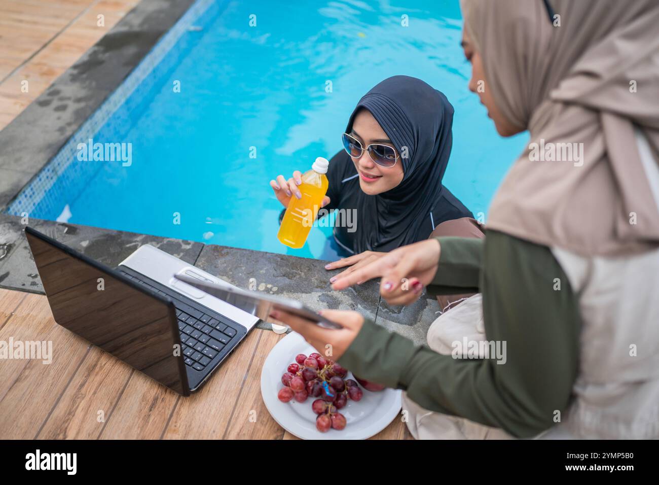 Engaging in Social Activities by the Pool Friends Savoring Refreshments ...