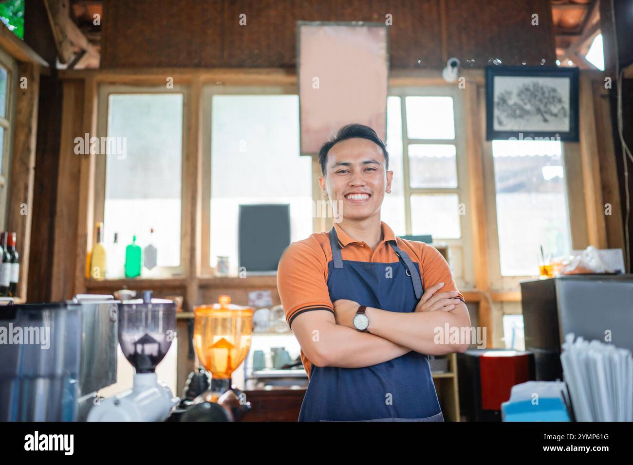 Asian male barista standing hi-res stock photography and images - Alamy