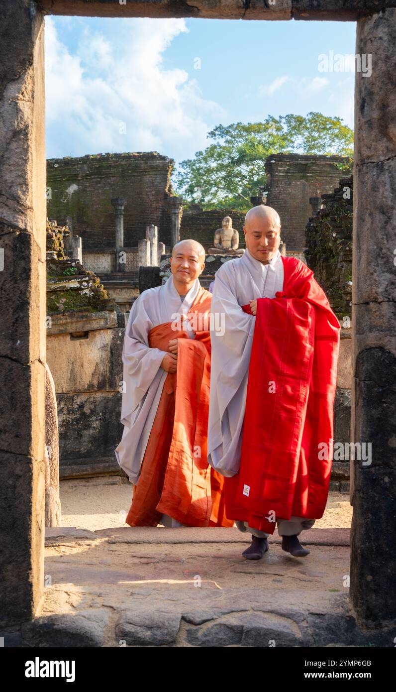Monk visiting ancient city of Polonnaruwa, UNESCO World Heritage Site ...
