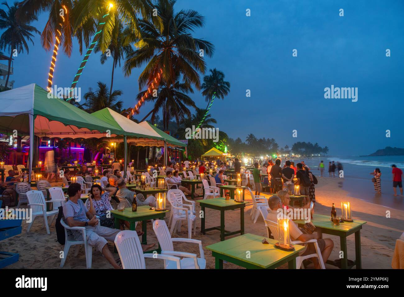 Restaurants on beach at dusk, Mirissa, South Coast, Sri Lanka Stock ...