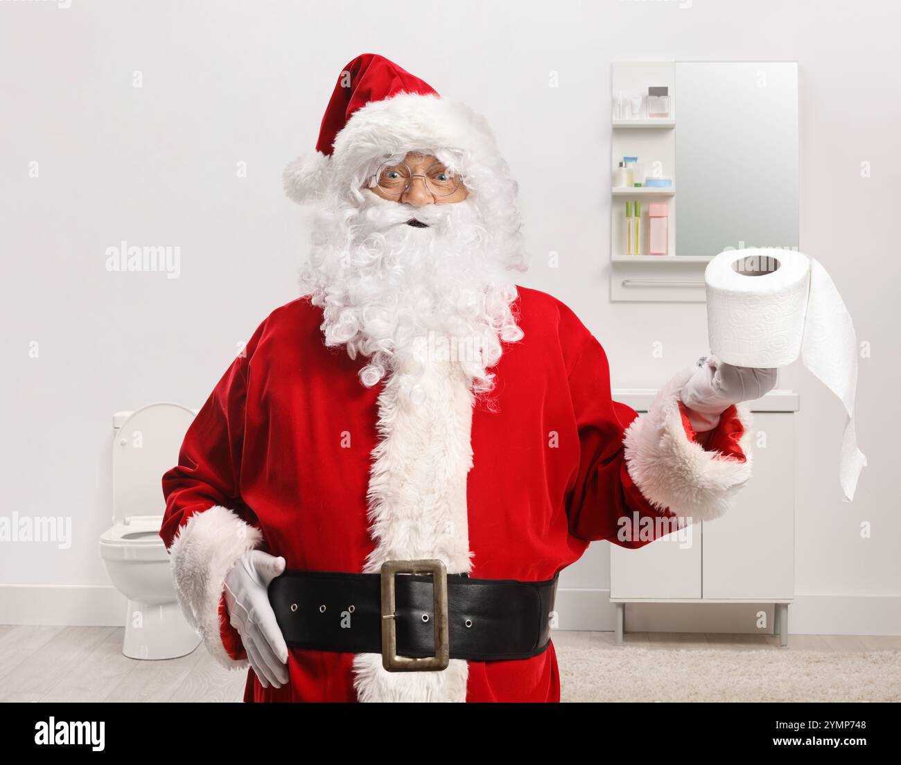 Santa claus holding a toilet paper roll in a bathroom Stock Photo - Alamy