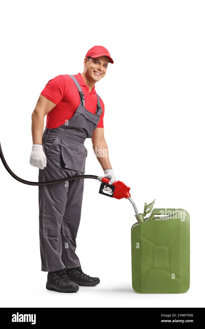Gas station worker filling a jerrycan with fuel and smiling isolated on ...