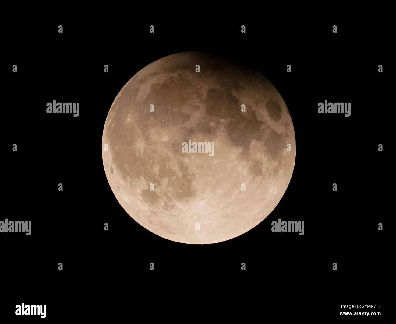 FILE - A supermoon with a partial lunar eclipse rises over Lake ...