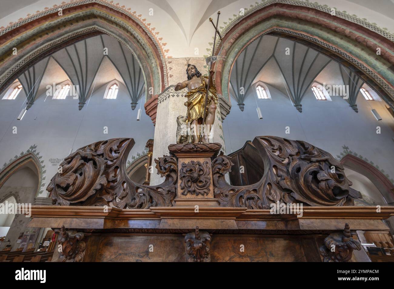 Figure of Jesus with the Lamb of God on the chancel entrance in the ...