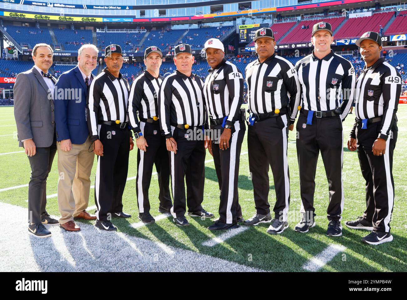 From left to right Larry Hill, Mike Wimmer, field judge Dyrol Prioleau ...