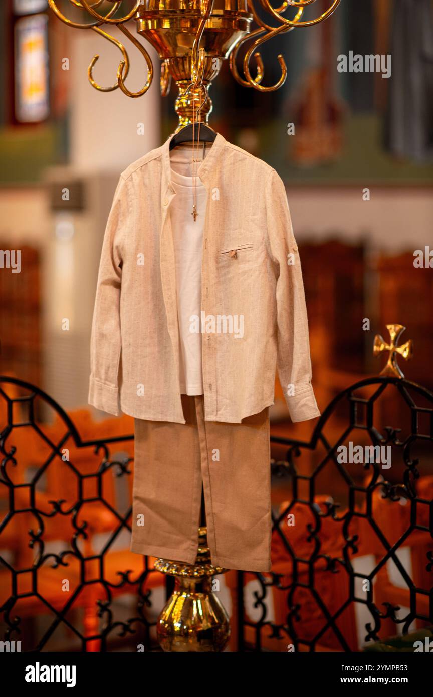 baptism clothes in a church Stock Photo - Alamy