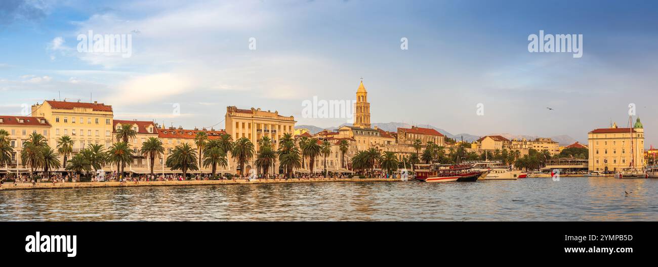 Sunset on the lively Riva promenade in Split, Croatia. Lined with palm ...