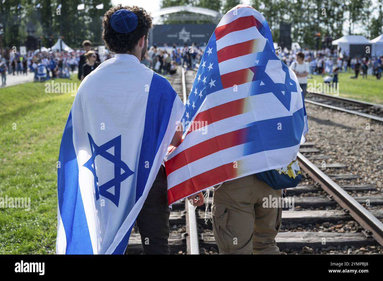 Jews with Israeli and USA flags during a ceremony at the concentration ...