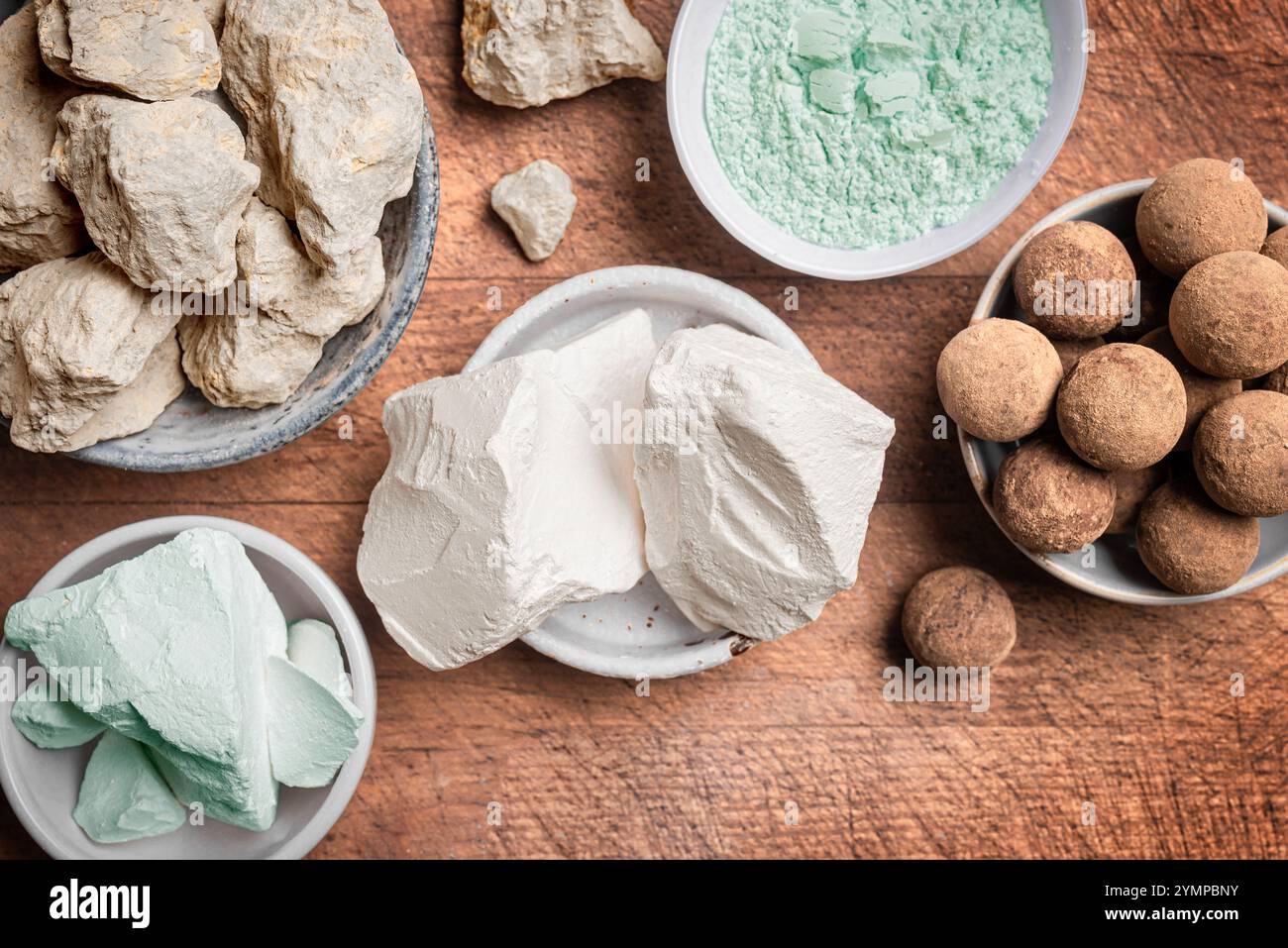 Edible caramel and green Clay Stones, clay rocks and powder on wooden ...