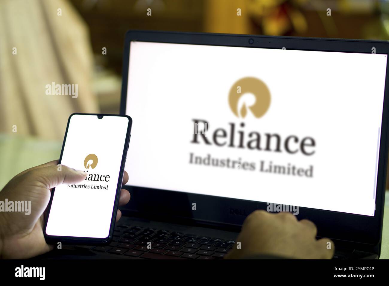 Reliance Industries Limited company logo displayed on mobile phone ...