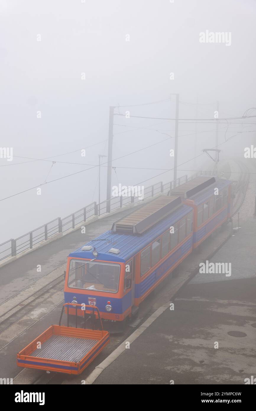 Mountain Train on Railroad Tracks in the Clouds in a Cloudy Day in ...