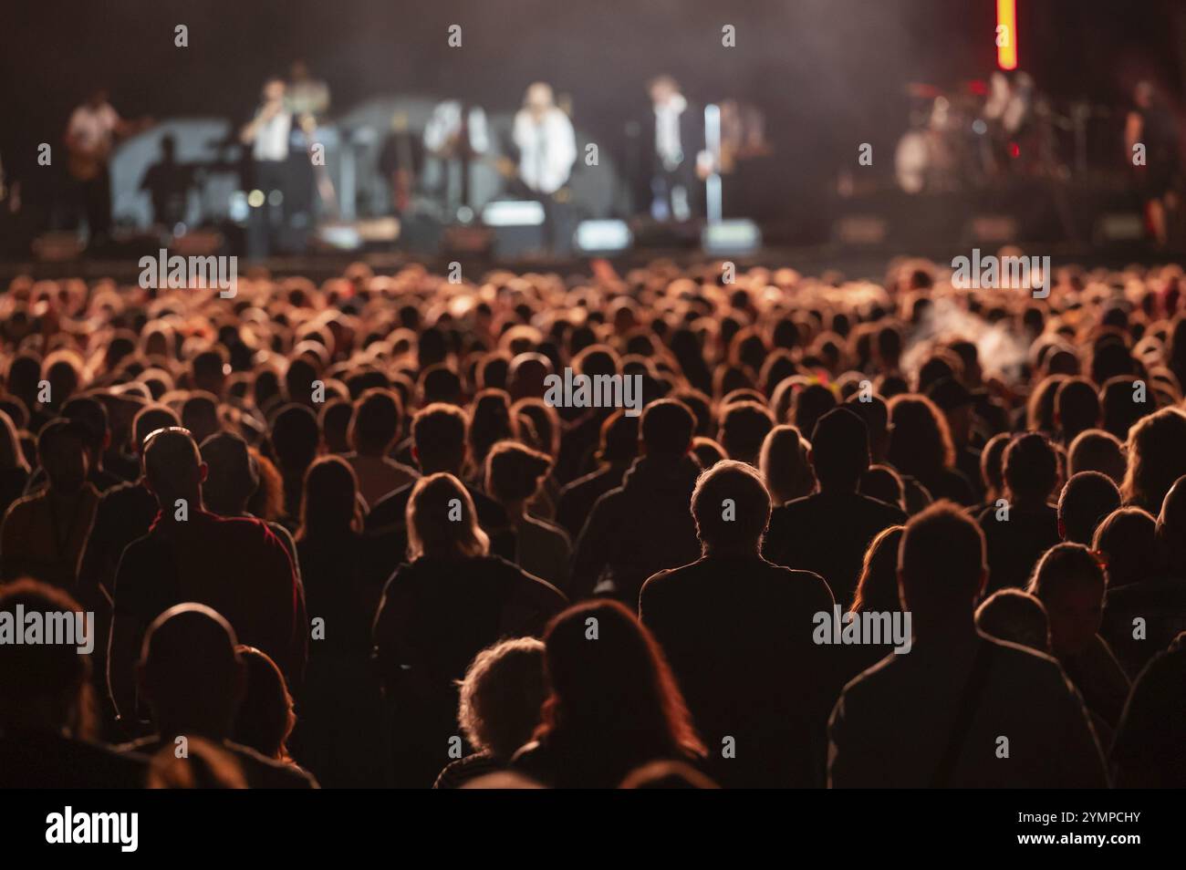 Crowd of people in front of the stage during the concert Stock Photo ...
