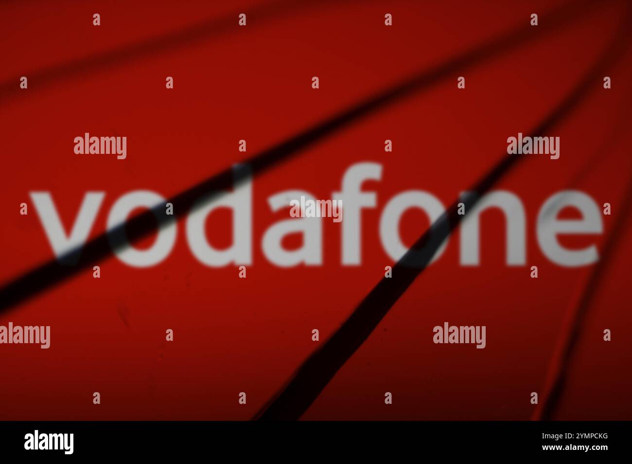 Vodafone logo is visible on the broekn glass hi-res stock photography ...