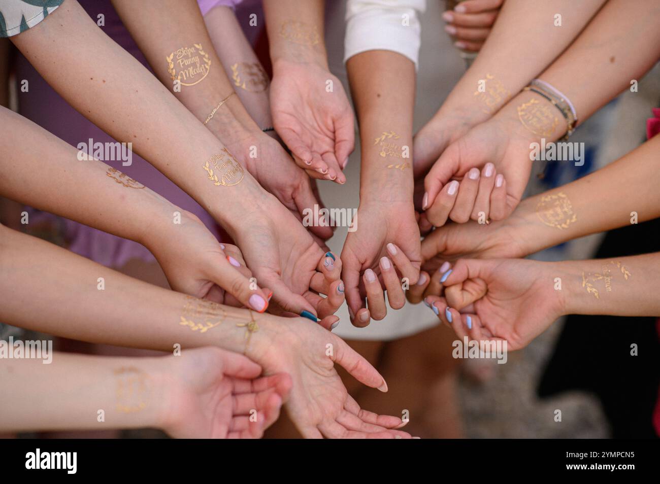 girls hands with temporary tattoos bachelorette party Stock Photo - Alamy
