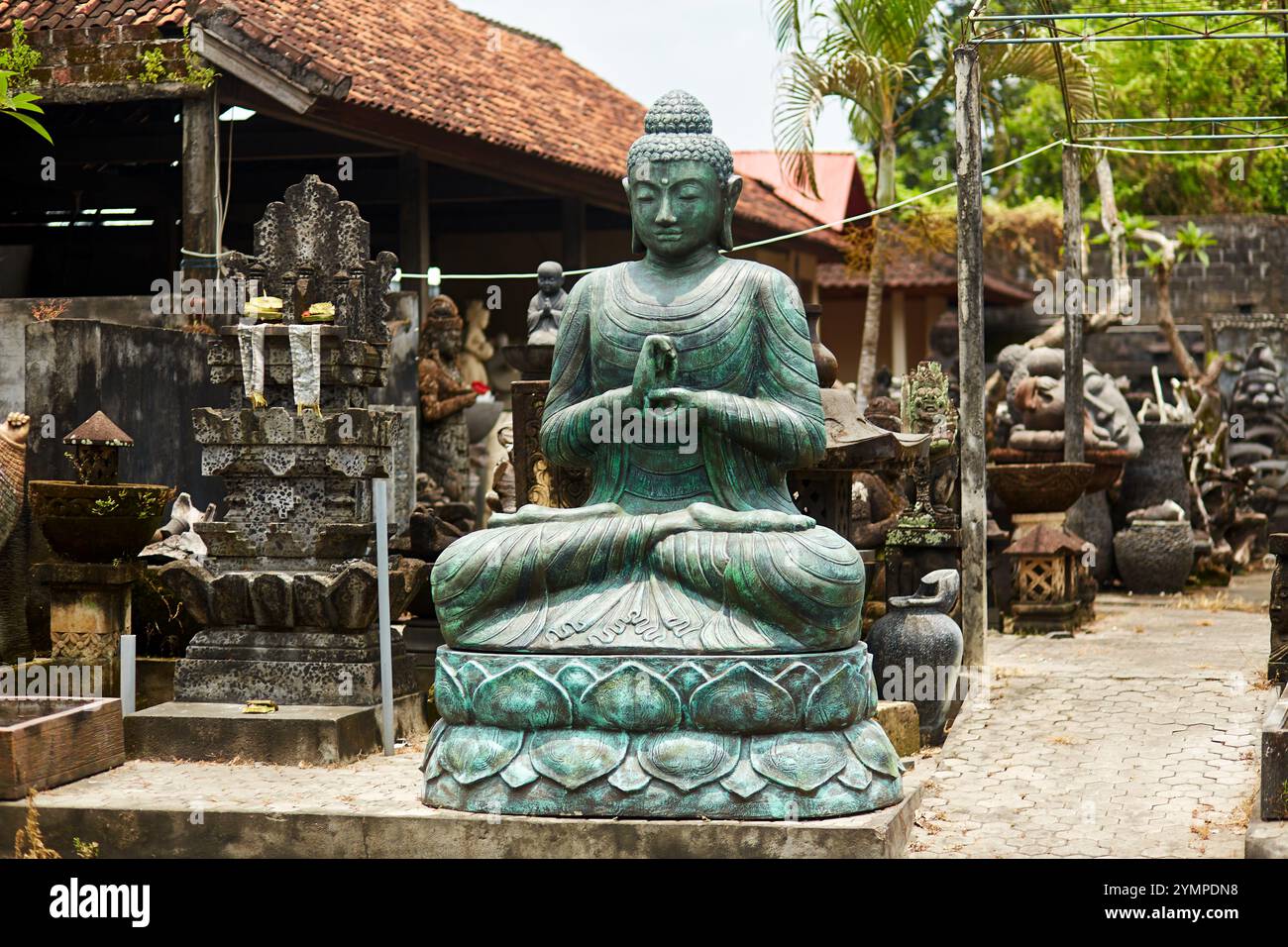 Sculpture of a temple with flowers and incense for ritual offerings on ...