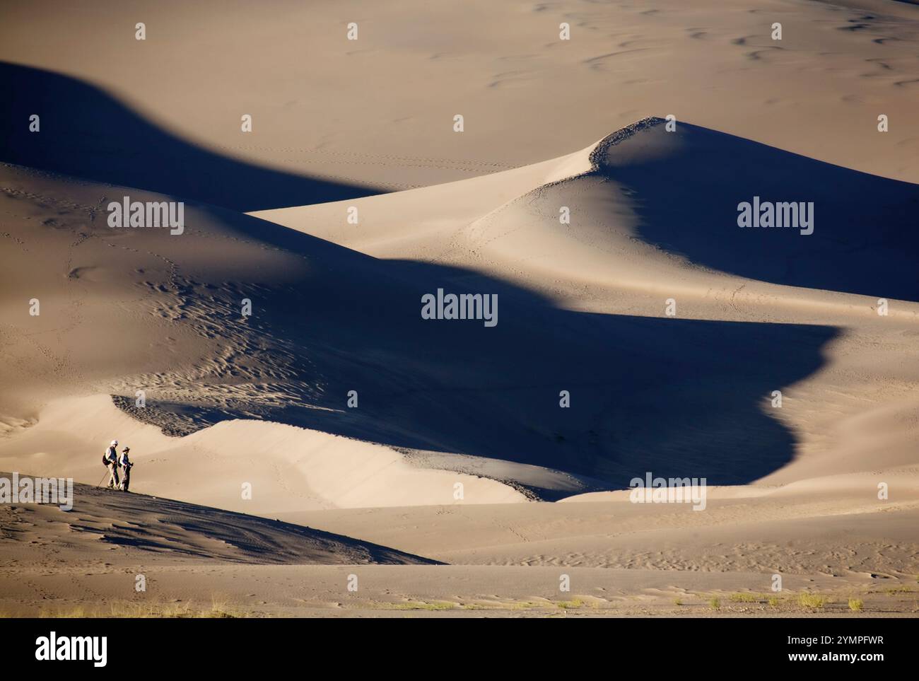 A couple ventures into the desert-like landscape of Great Sand Dunes ...