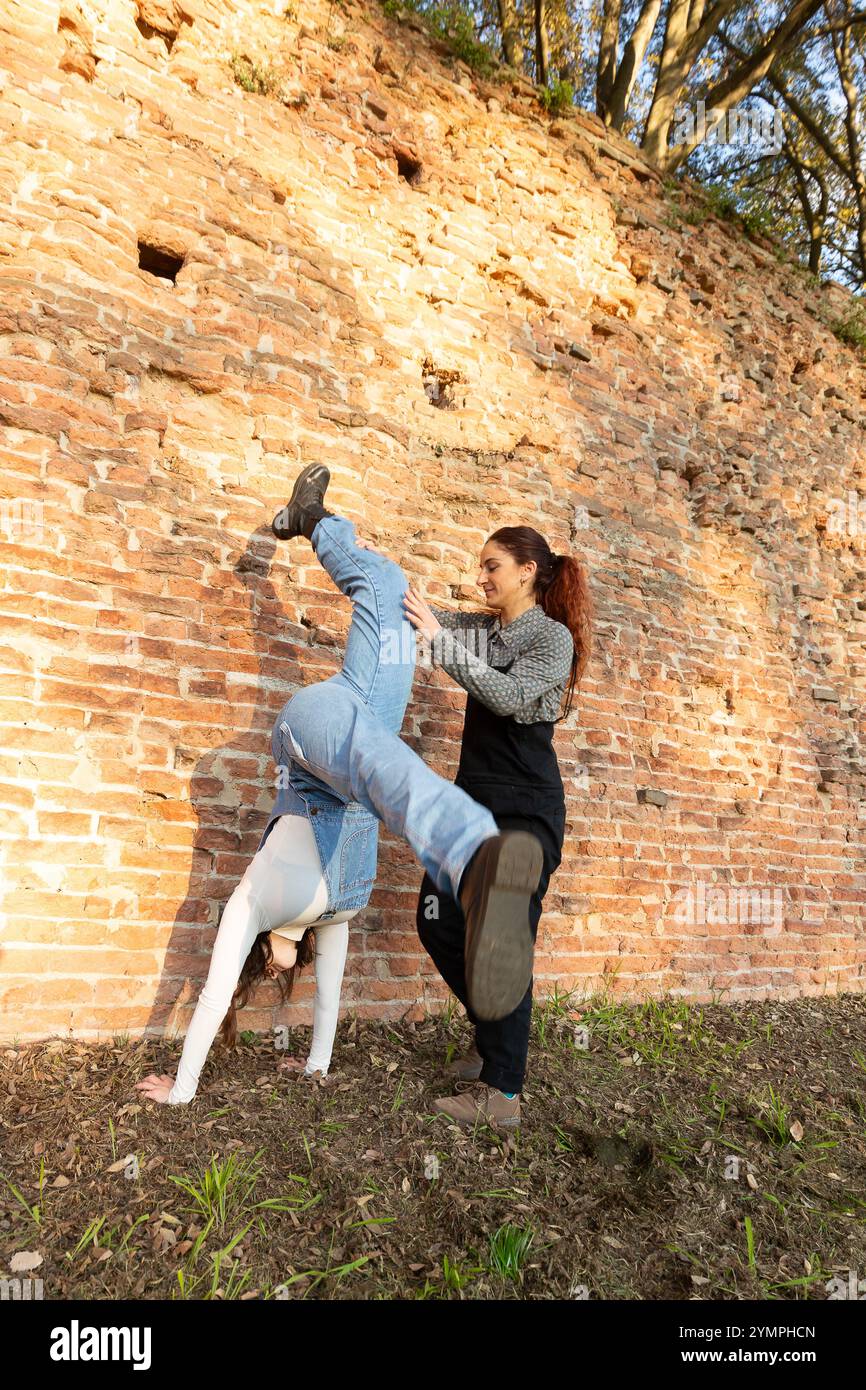 Handstands in park hi-res stock photography and images - Alamy