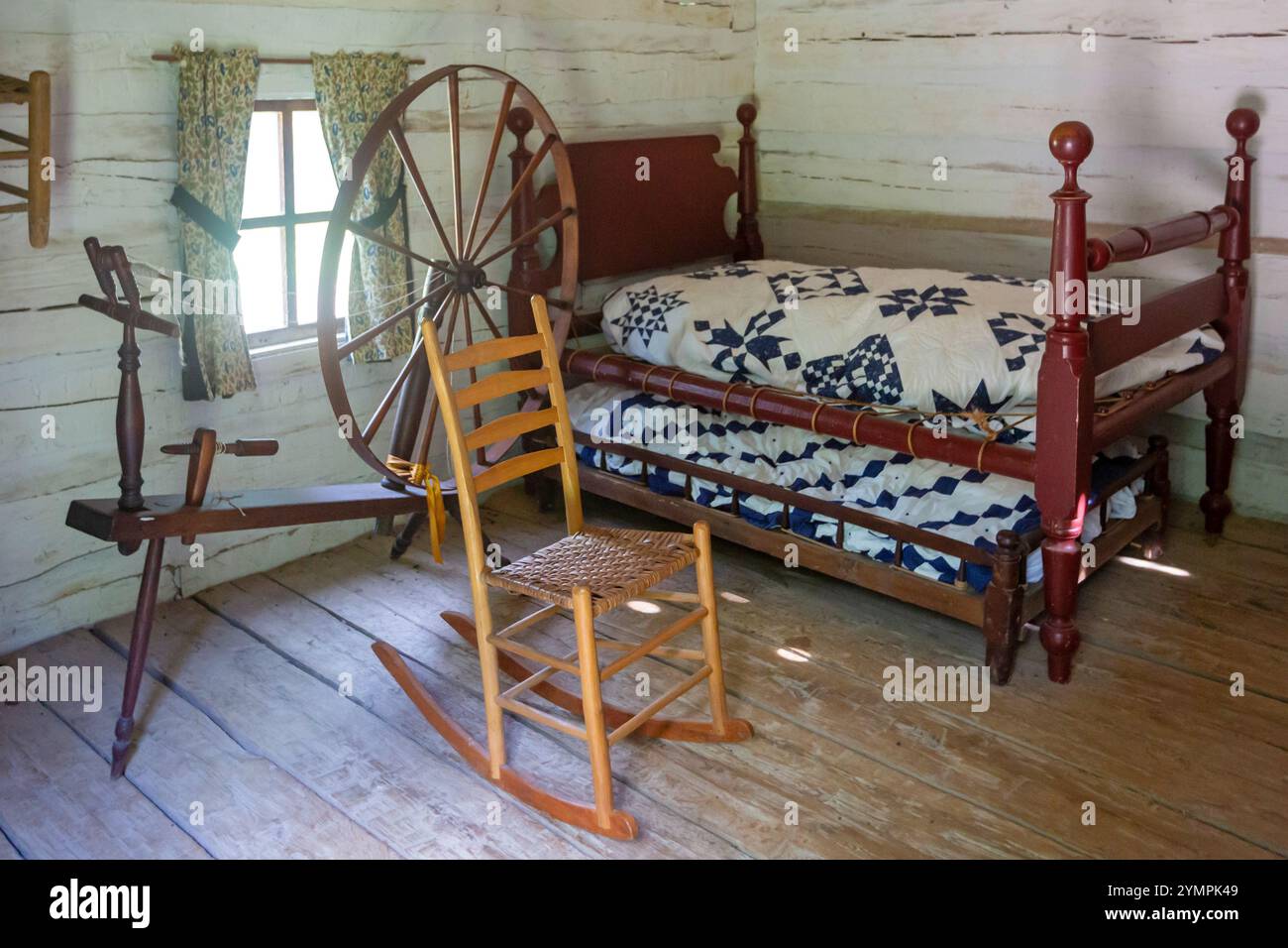 Petersburg, Illinois - A spinning wheel, a rocking chair, and a trundle ...