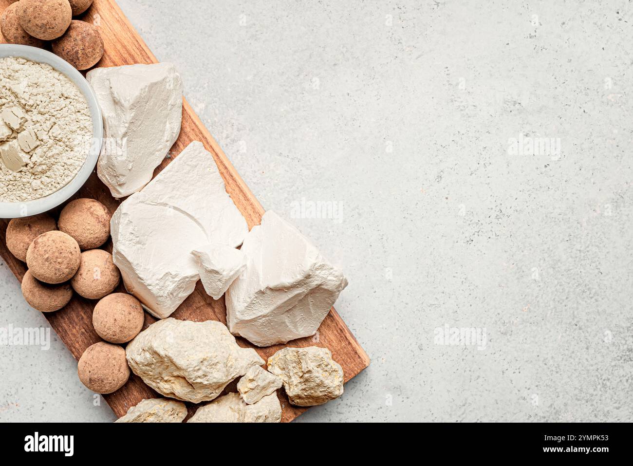 Edible caramel Clay Stones, clay rocks and powder on white stone ...