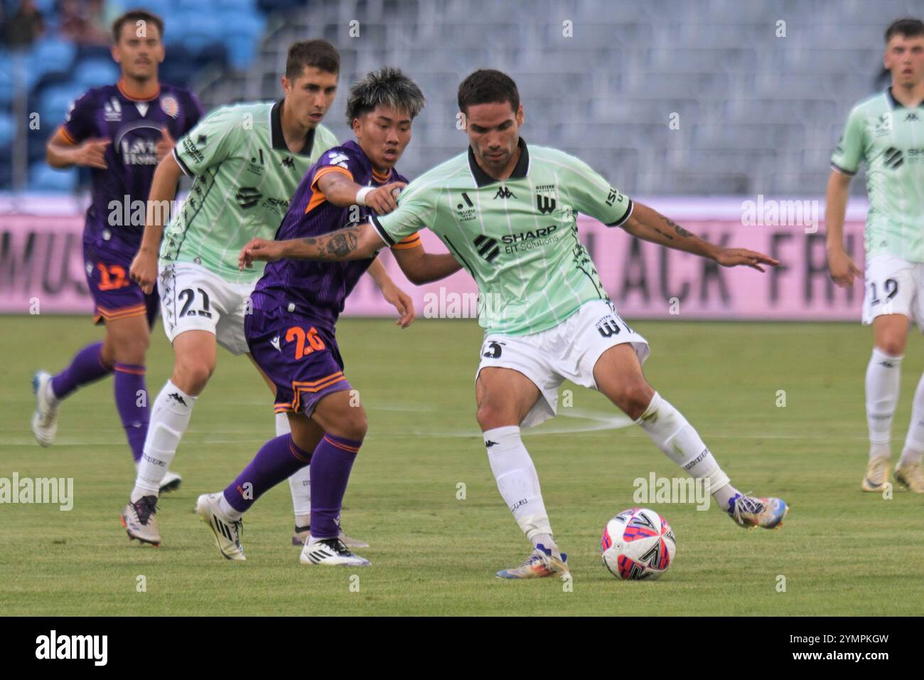 Khoa Ngo (L) of Perth Glory FC and Tate Jackson Russell (R) of Western United FC seen in action ...
