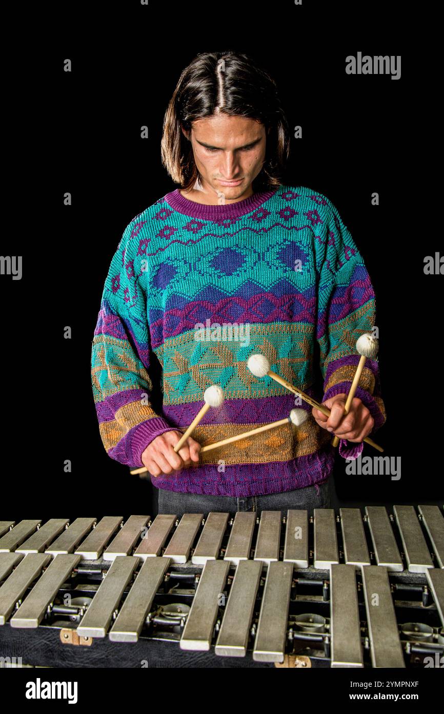 Young jazz musician playing the vibraphone in his private rehearsal ...