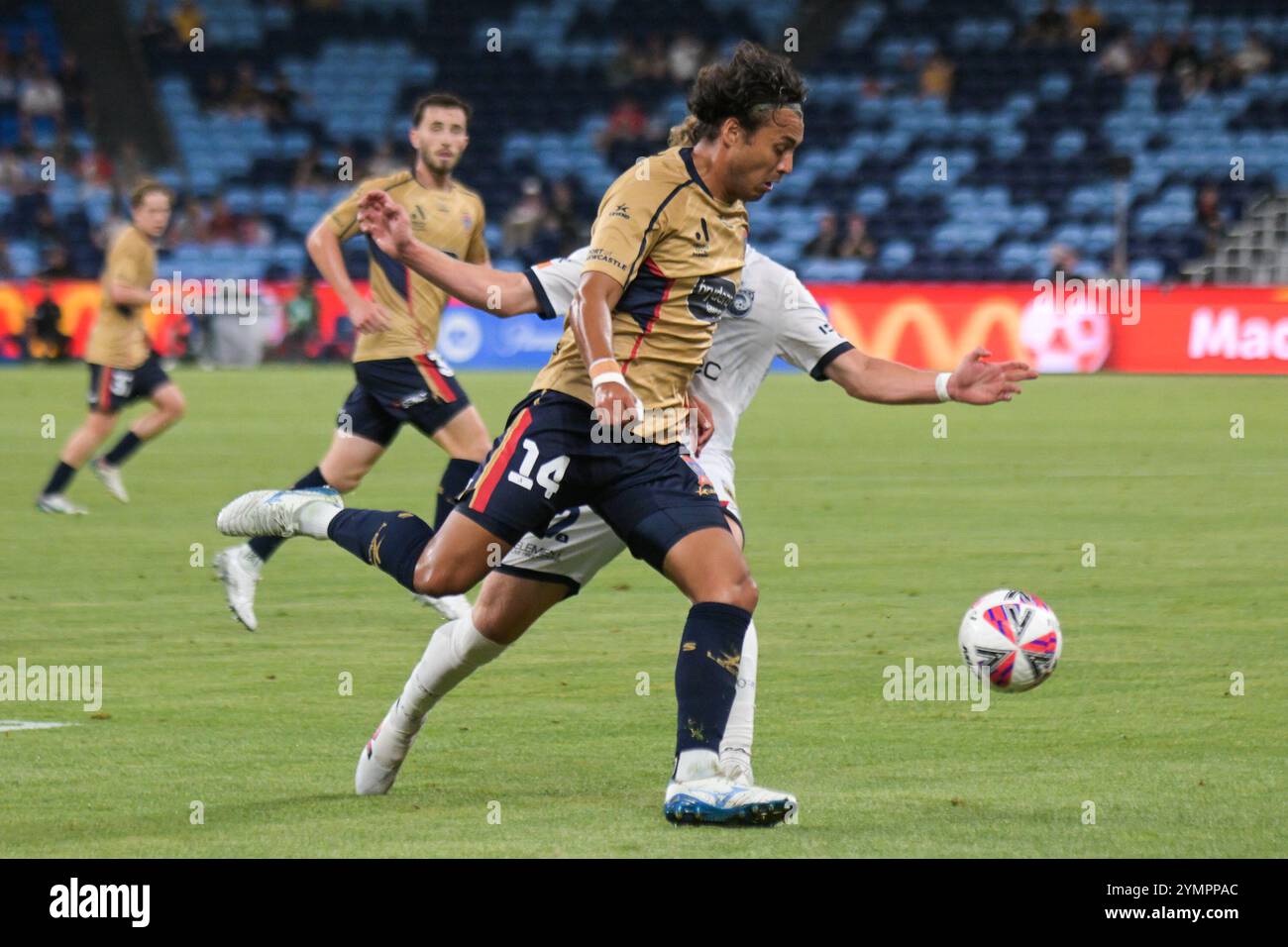 Dane James Ingham (front) of Newcastle Jets FC and Lucas Alexander ...