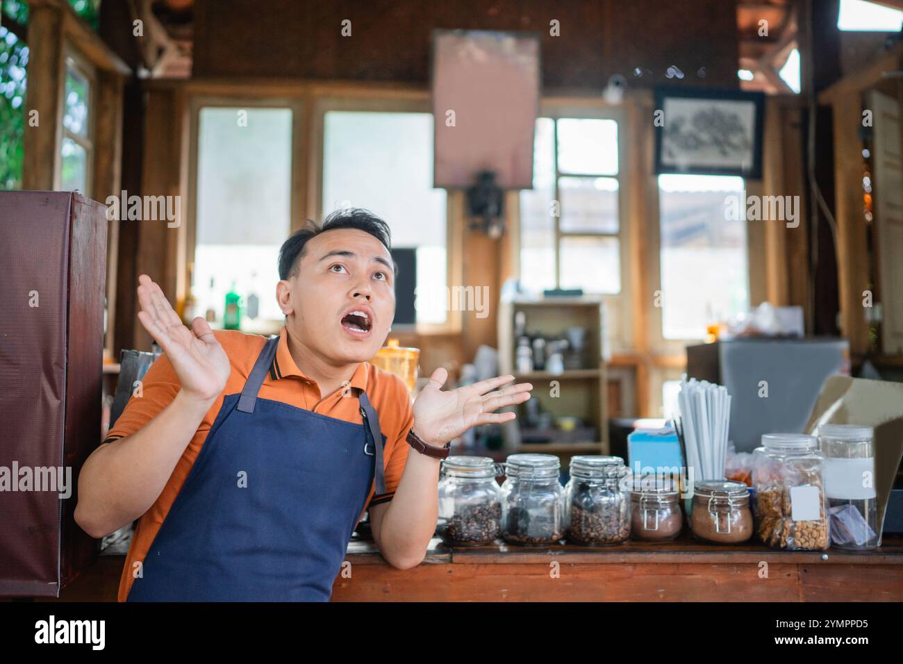 male coffee shop staff open arm gesture Stock Photo - Alamy
