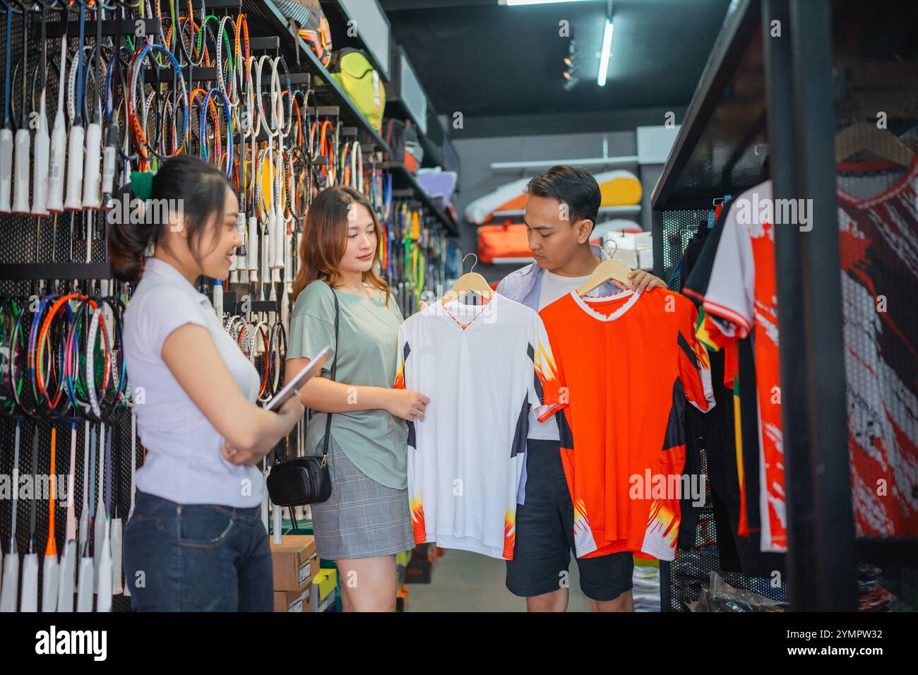 Female buyer choosing sport hi-res stock photography and images - Alamy