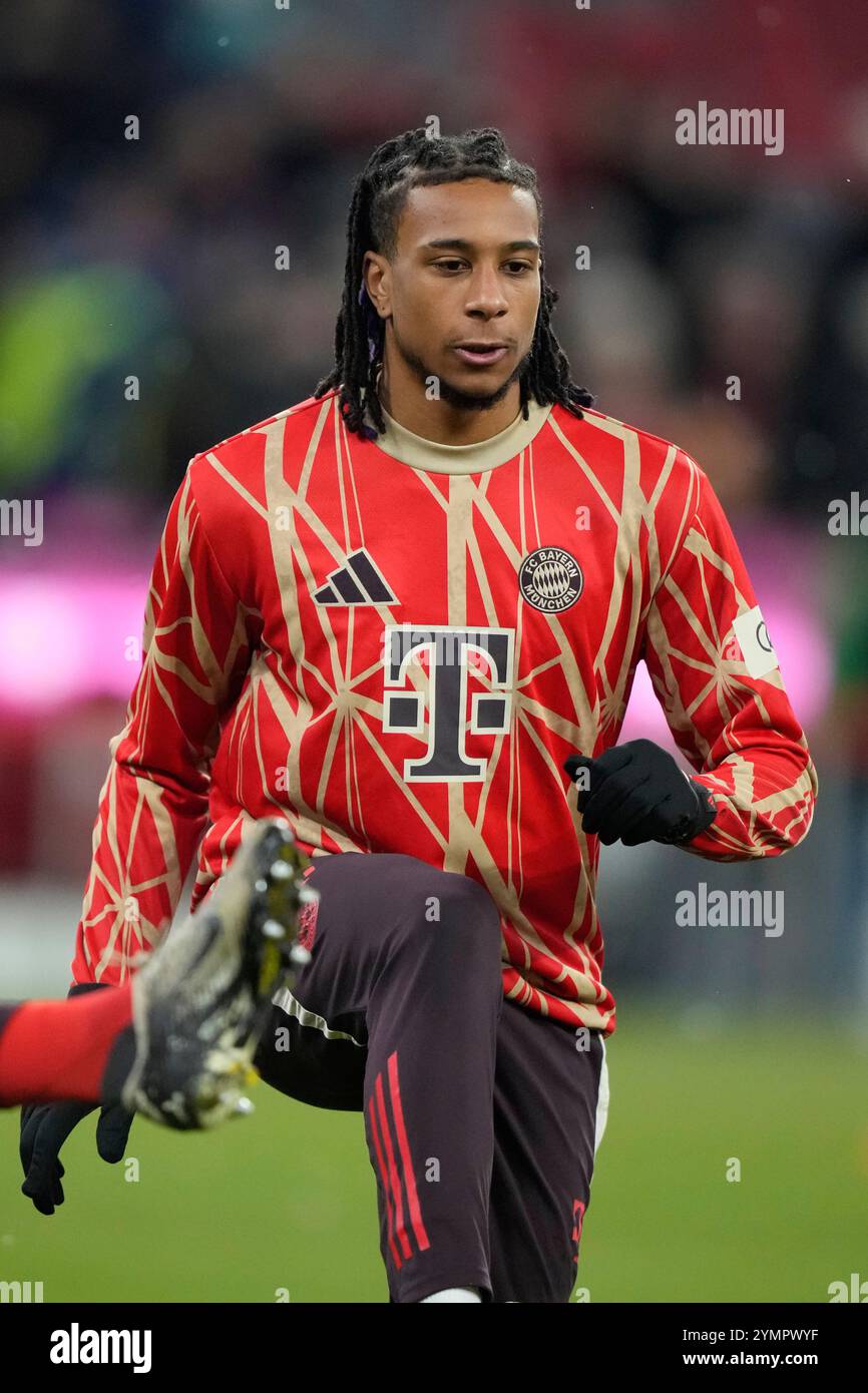 Bayern's Michael Olise warms up before the start of the Bundesliga ...