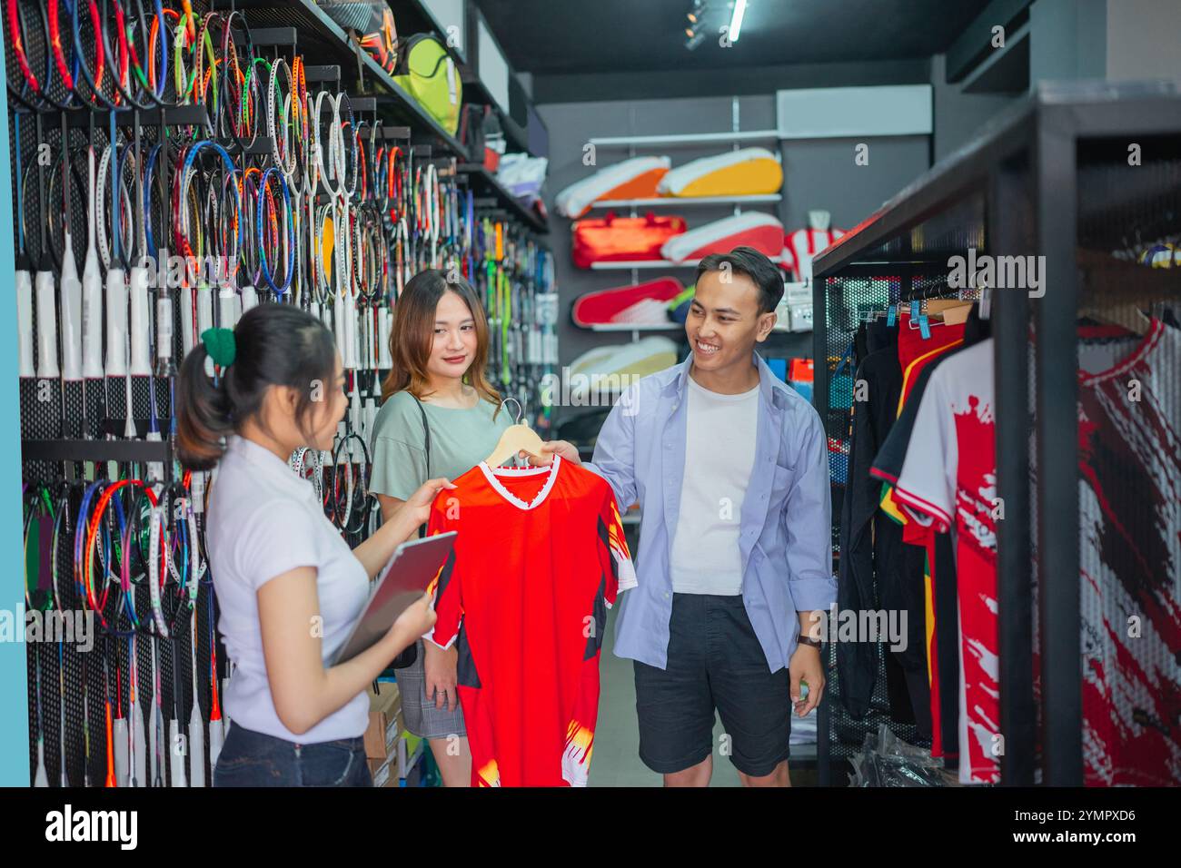 Female buyer choosing sport hi-res stock photography and images - Alamy