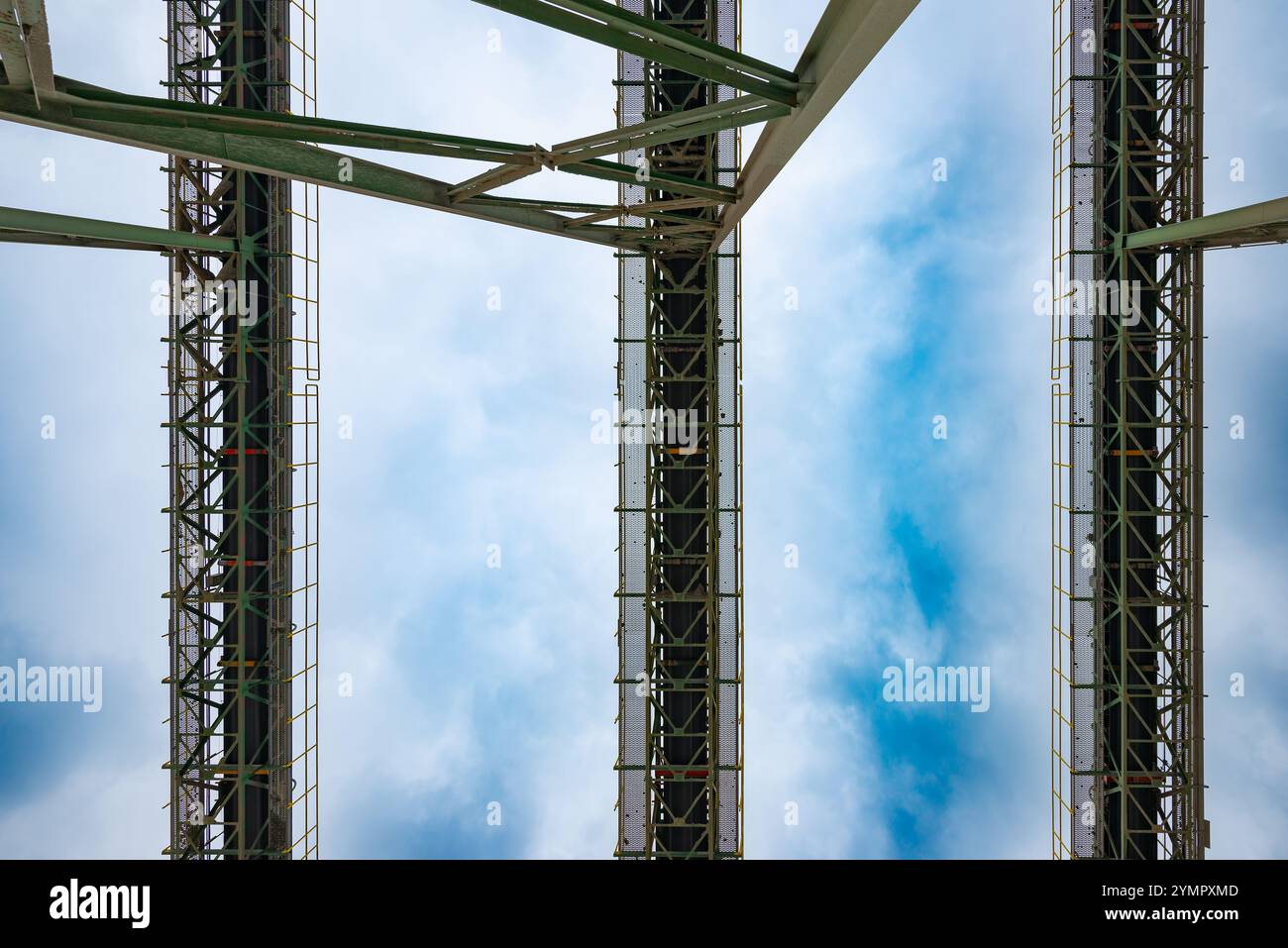View from below of long conveyor belts and mineral processing plant at ...
