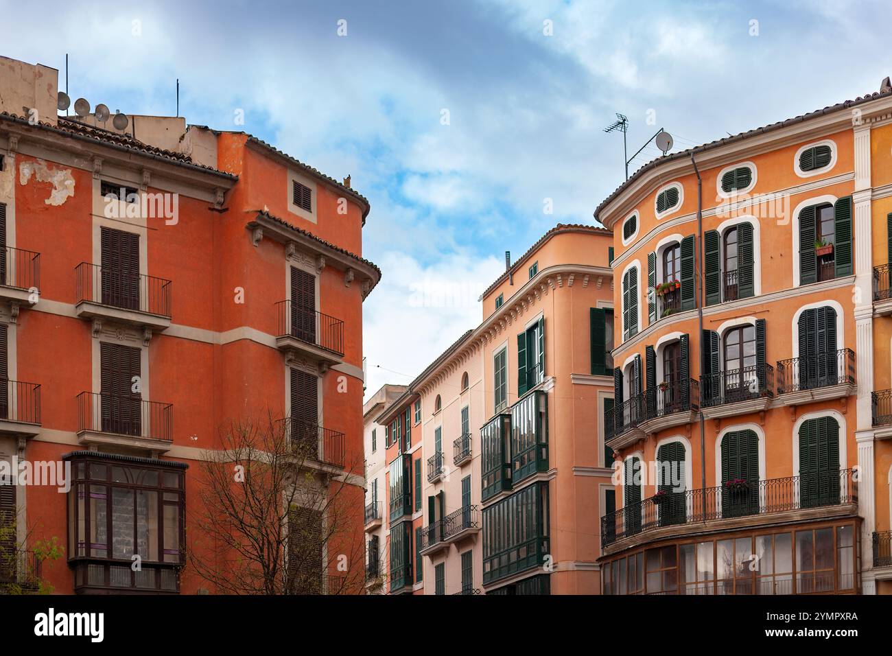 Colorful buildings line the streets of Palma de Mallorca, capturing the ...