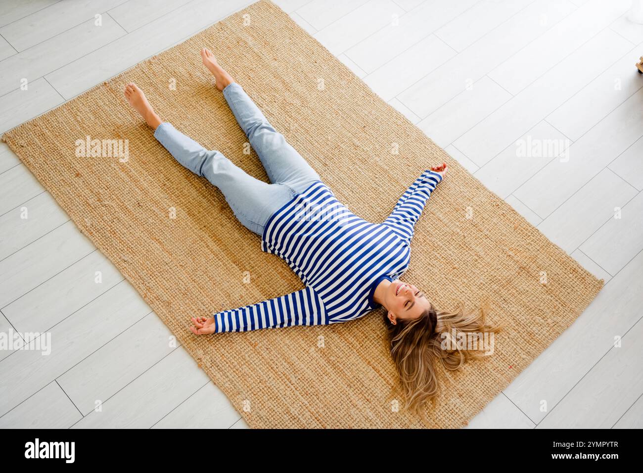 Full body top view photo of blonde young girl lying floor shavasana ...