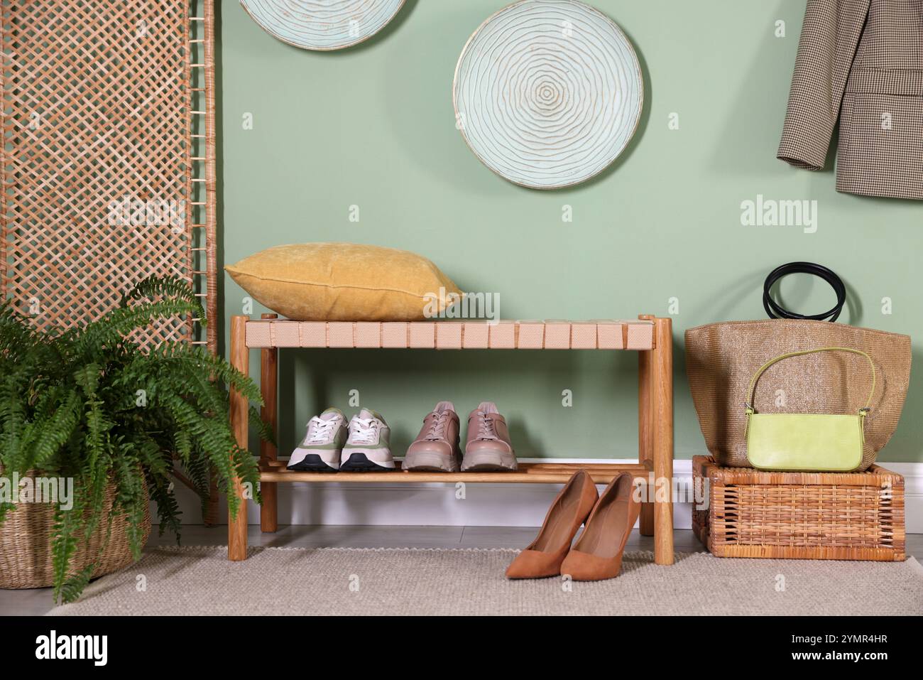 Stylish hallway interior with bench and folding screen Stock Photo - Alamy