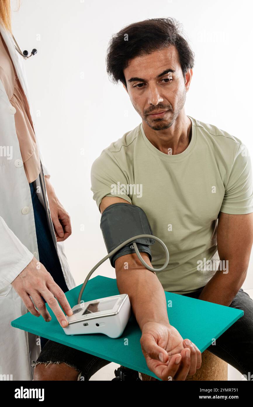 Female doctor measuring blood pressure Stock Photo - Alamy