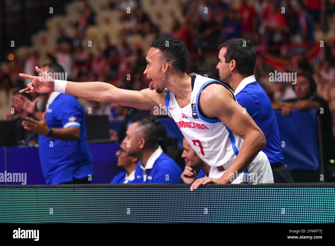 Adris de Leon (Dominican Republic) cheering his team from the bench ...