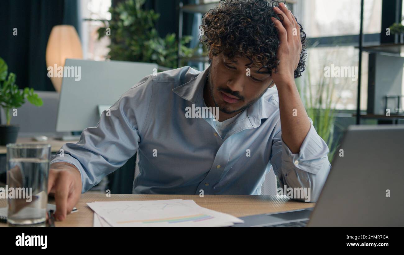 Frustrated Indian business man Arabian businessman at office desk ...