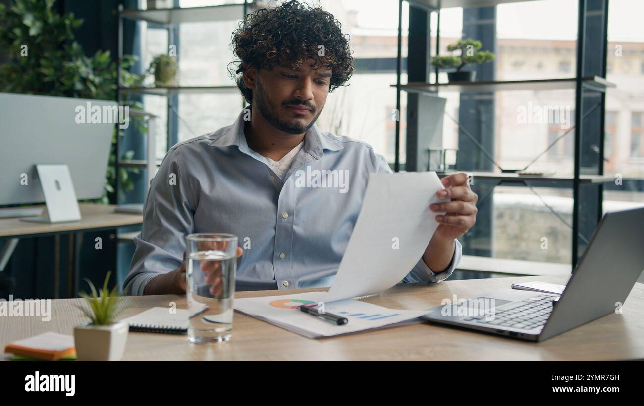 Frustrated Indian business man Arabian businessman at office desk ...