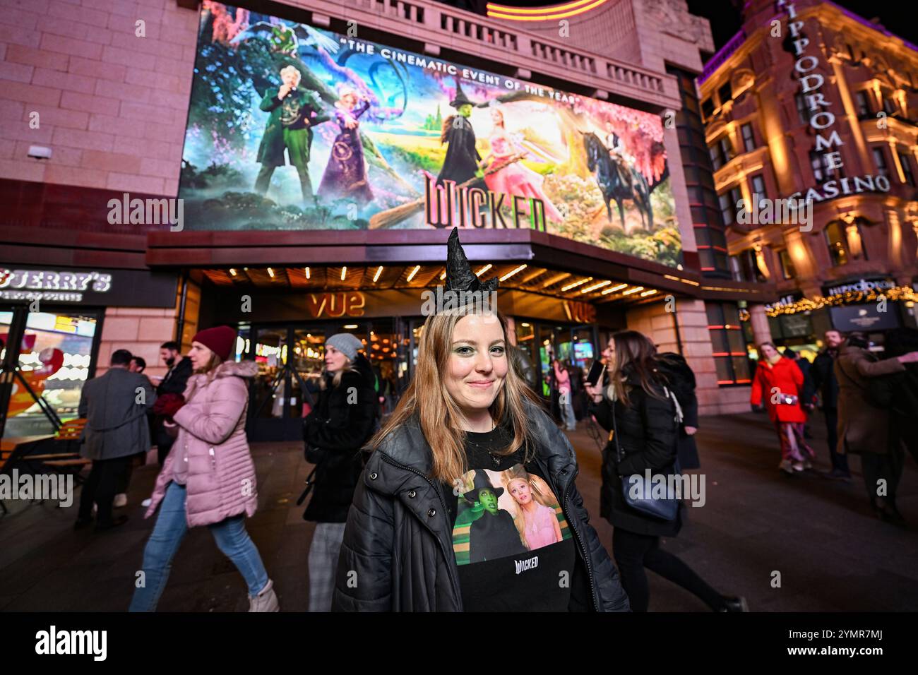 EDITORIAL USE ONLY Cinemagoers outsideside Vue West End in London's Leicester Square on opening ...