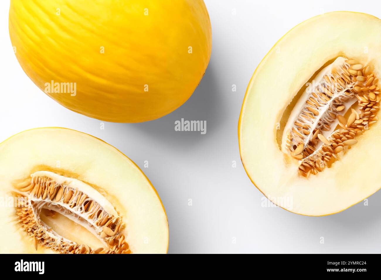 Fresh whole and cut melons on white background, flat lay Stock Photo ...