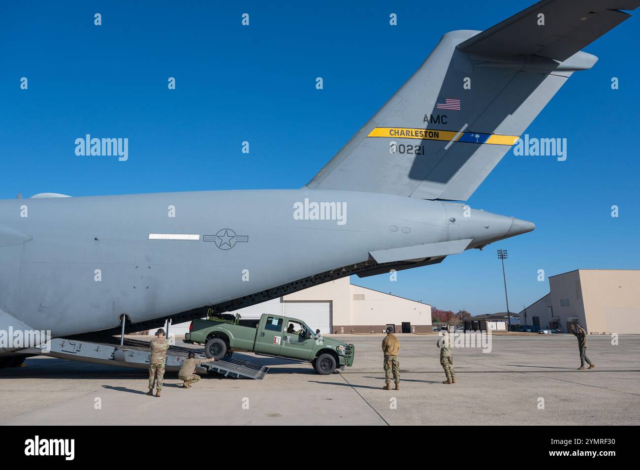 U.S. Air Force loadmasters from the 16th Airlift Squadron load a ...
