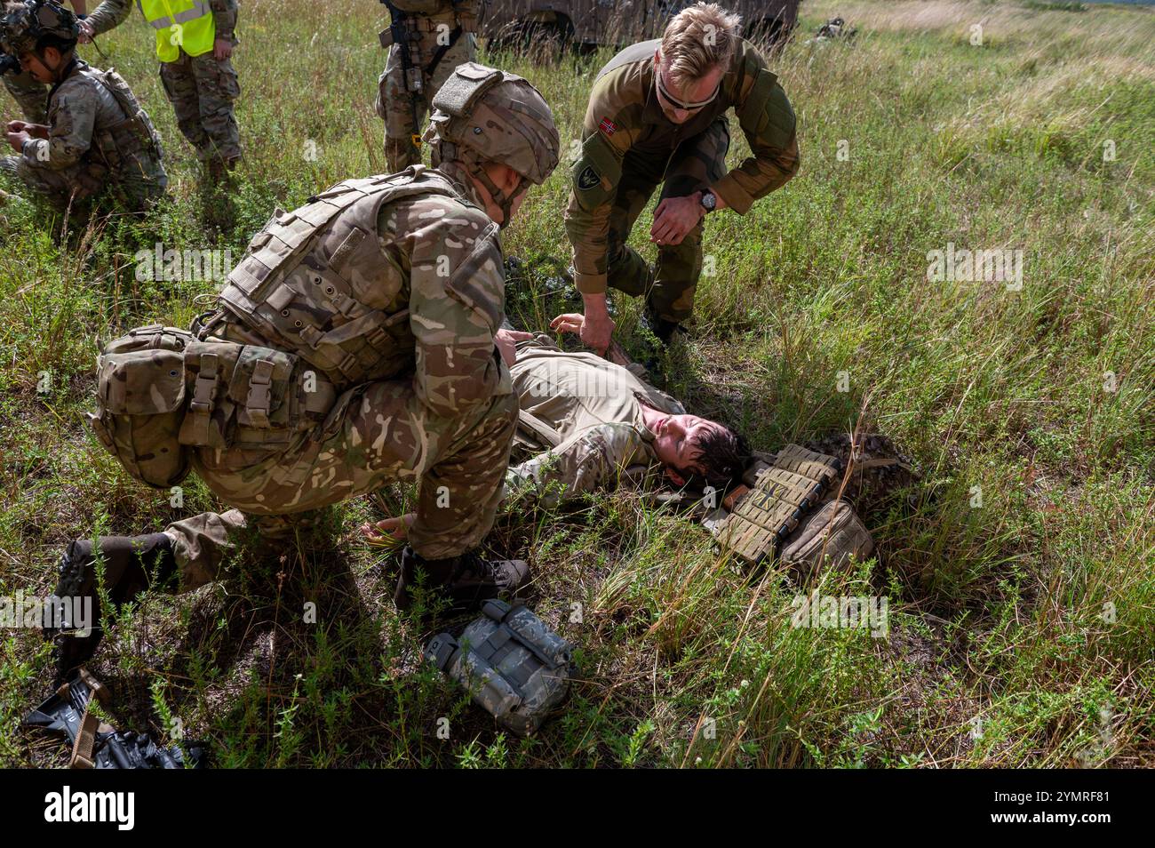 A U.S. Air Force Airman assigned to the 820th Base Defense Group and a ...
