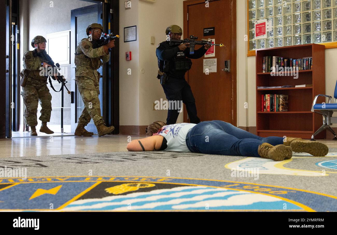 Members from the 436th Security Forces Squadron enter the passenger ...