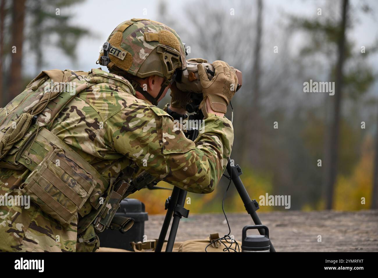 A U.S. Soldier watches the impact are during the launch of a ...