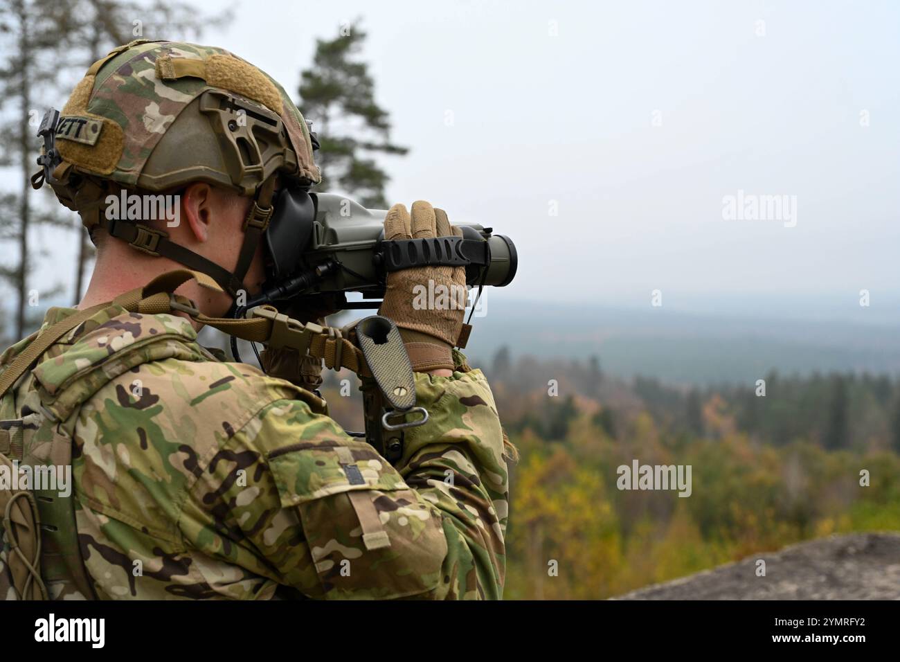A U.S. Soldier watches the impact are during the launch of a ...