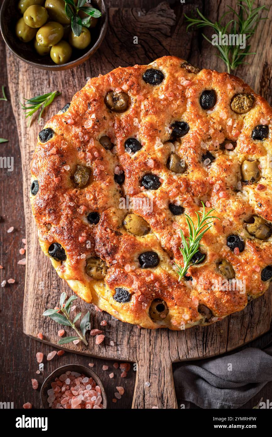 Hot focaccia with different types of olives. Traditional focaccia ...