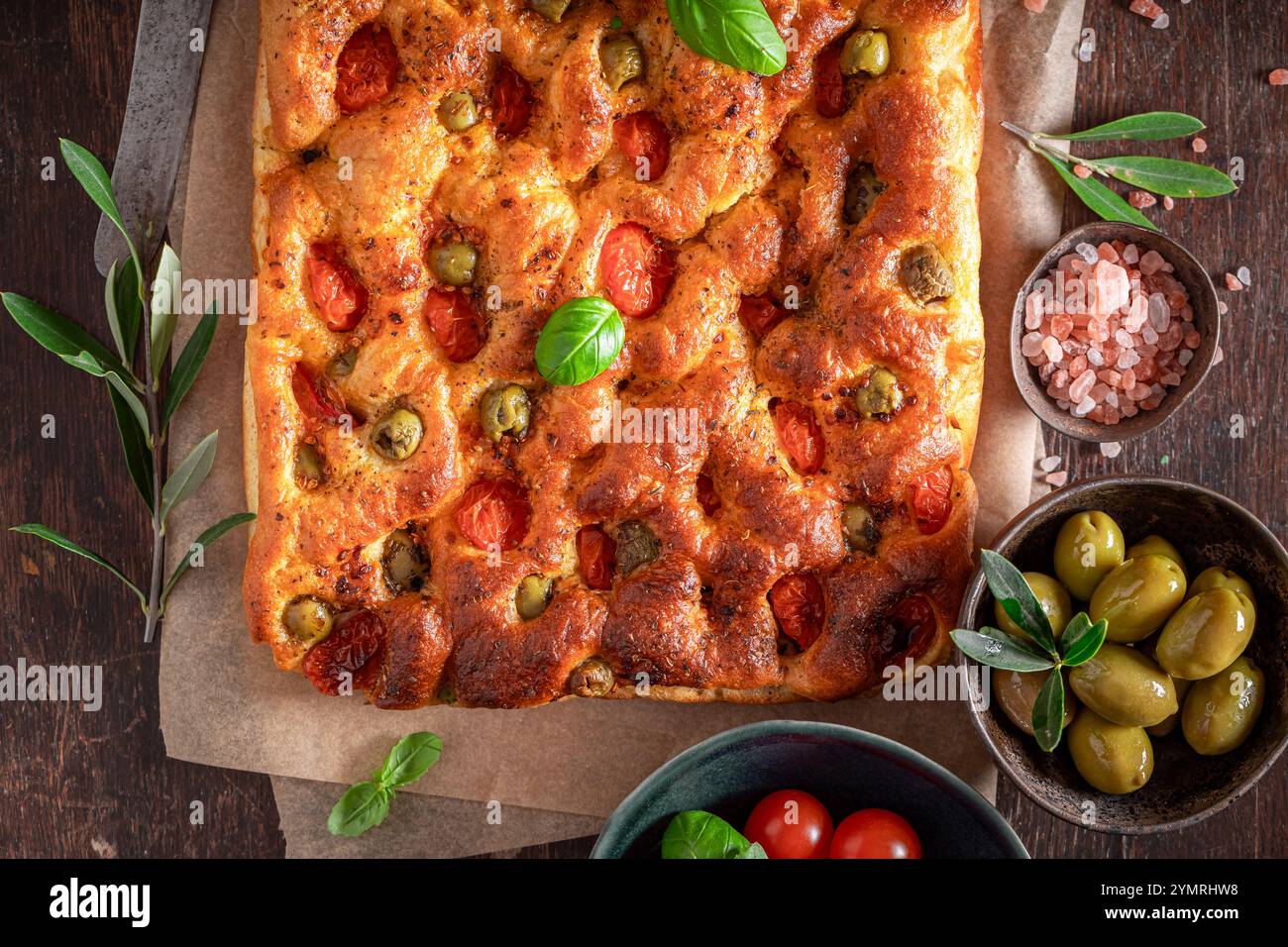 Traditional focaccia made of olives and cherry tomatoes. Classic ...
