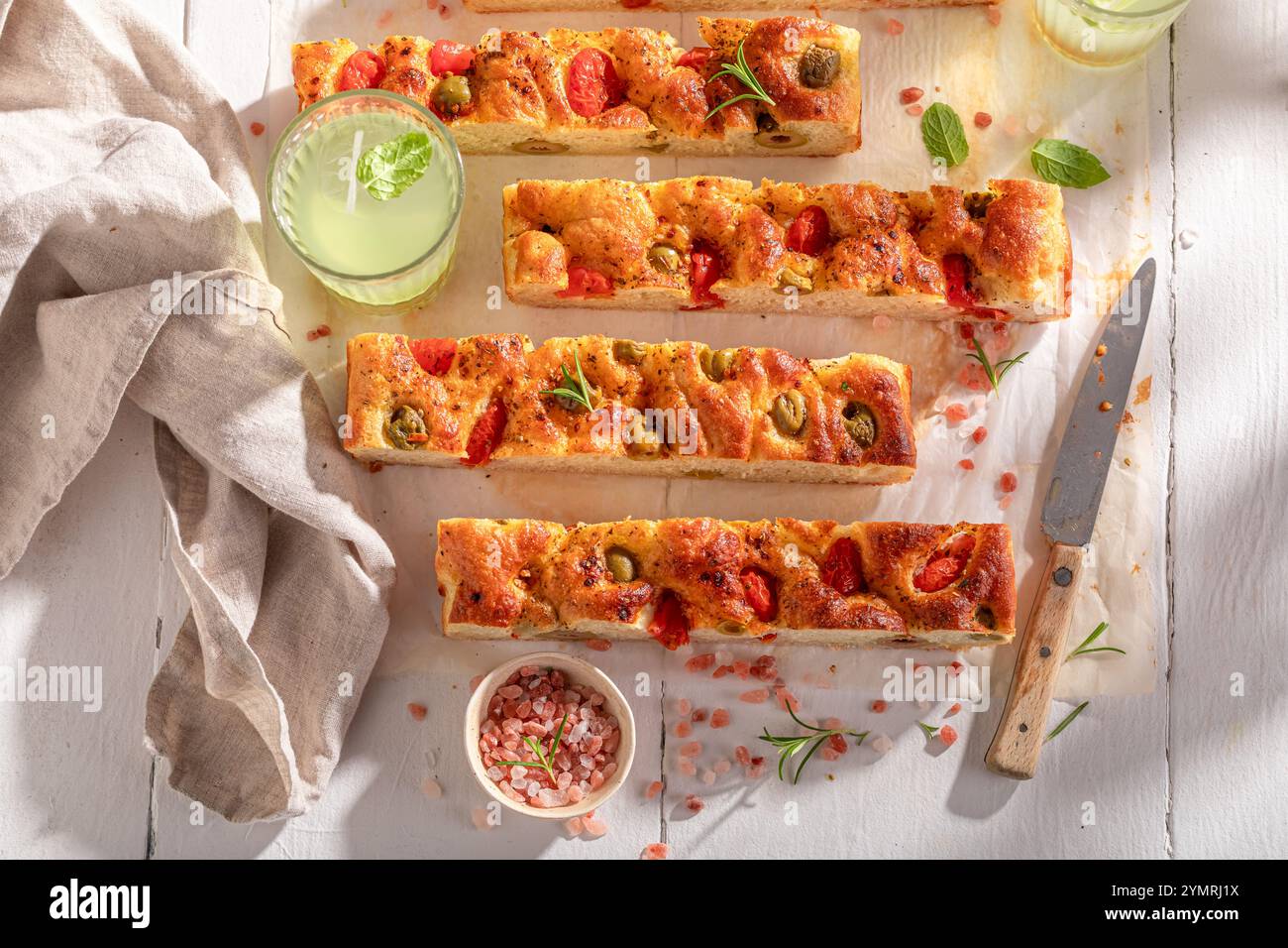 Tasty and homemade focaccia with olives and served with lemonade ...